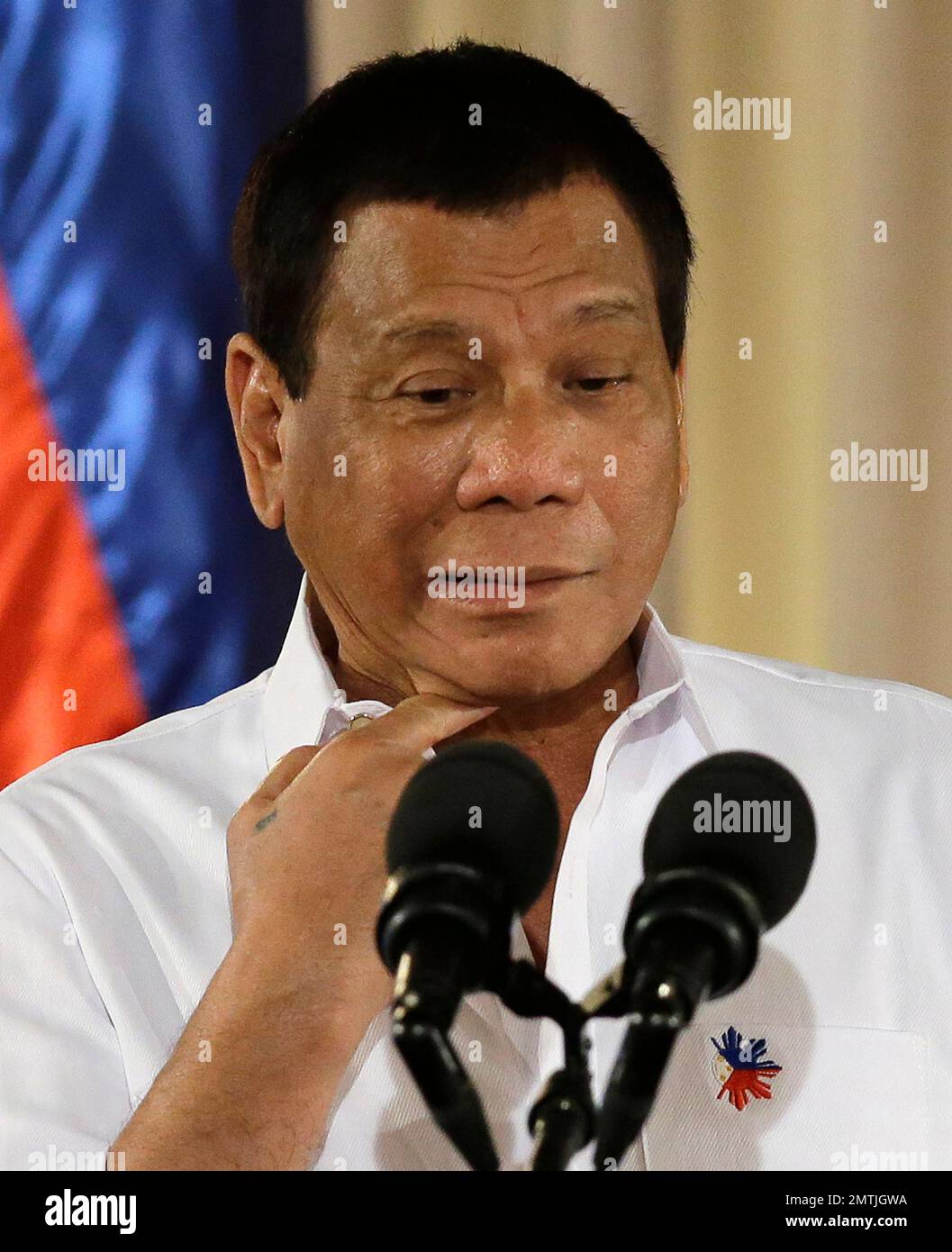 Philippine President Rodrigo Duterte gestures during his speech at the ...