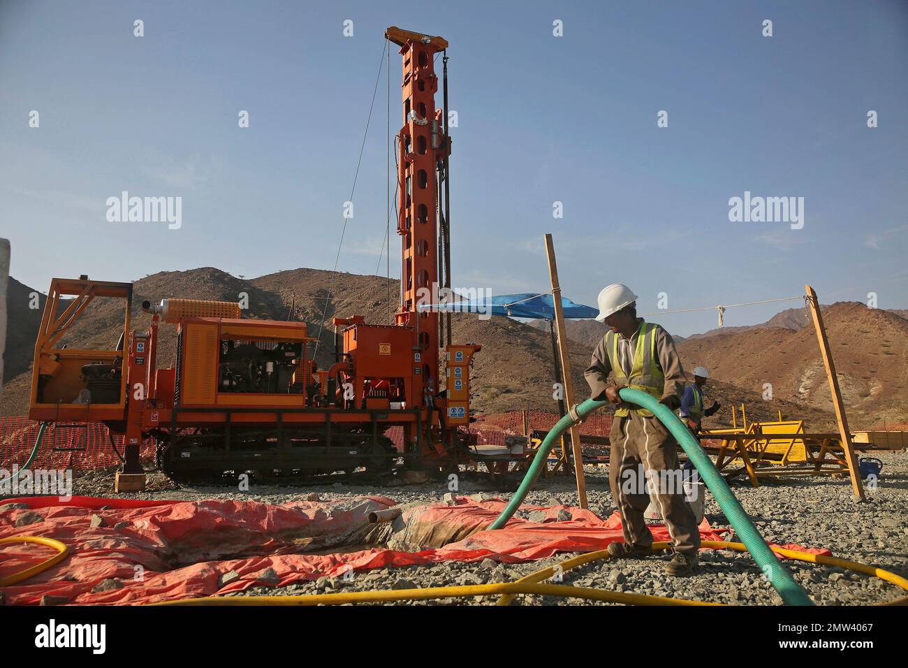 In this March 1, 2017 photo, crew at the Oman Drilling Project use a ...