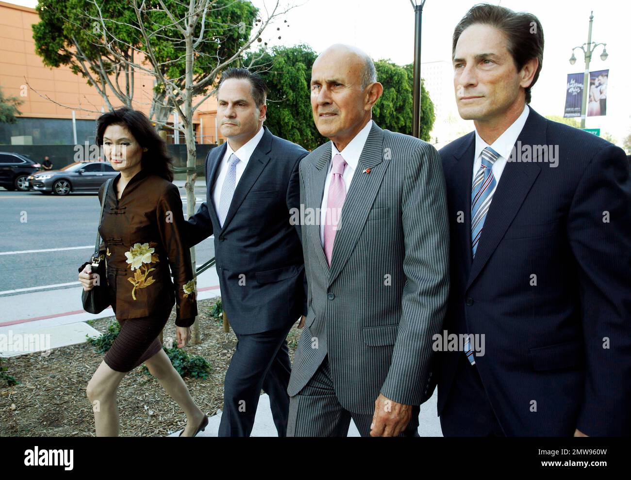 Former Los Angeles County Sheriff Lee Baca, second from right, leaves ...