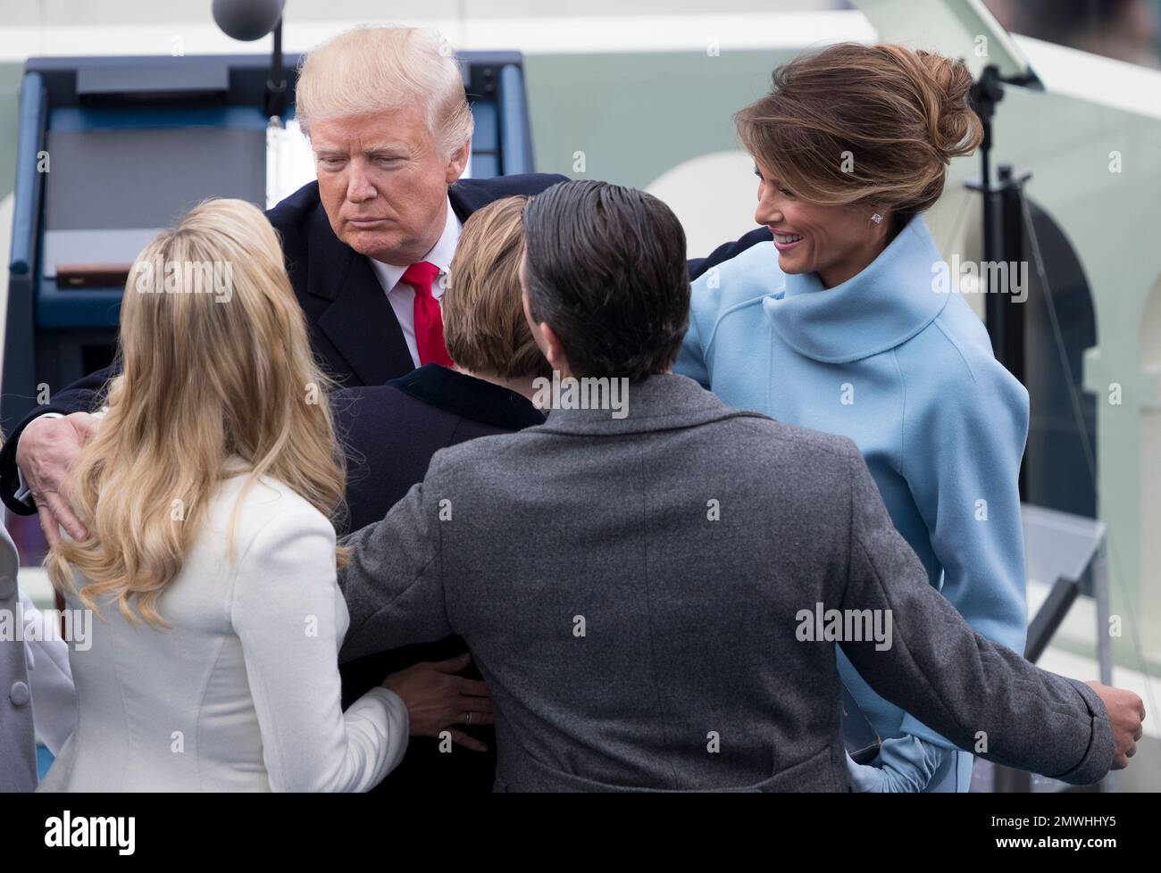 Donald Trump is embraces his family after being sworn in as the 45th ...