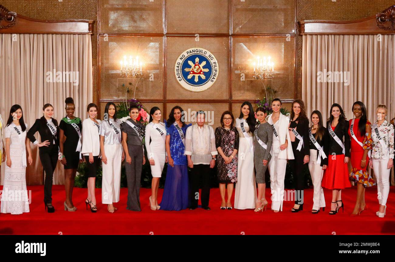 Philippine President Rodrigo Duterte, center, and Tourism Secretary ...