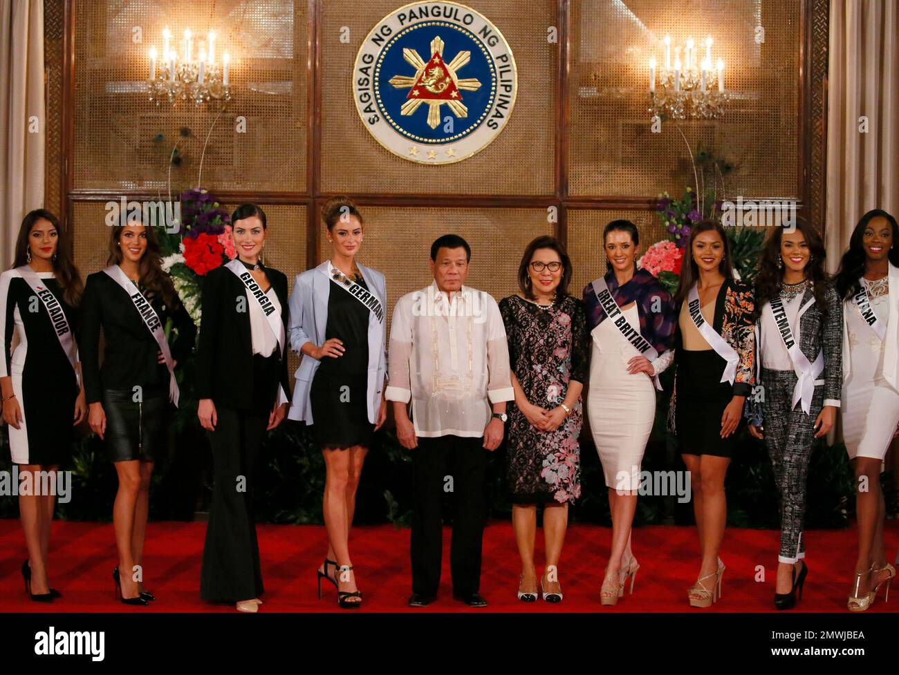 Philippine President Rodrigo Duterte, center, and Tourism Secretary ...