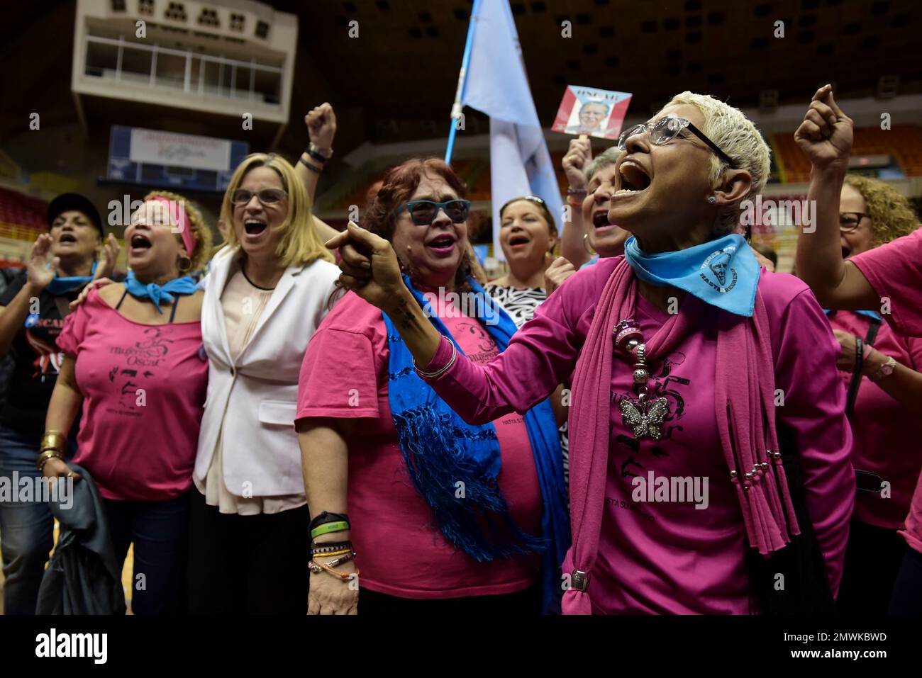 A group of women celebrate during a press conference convened at ...