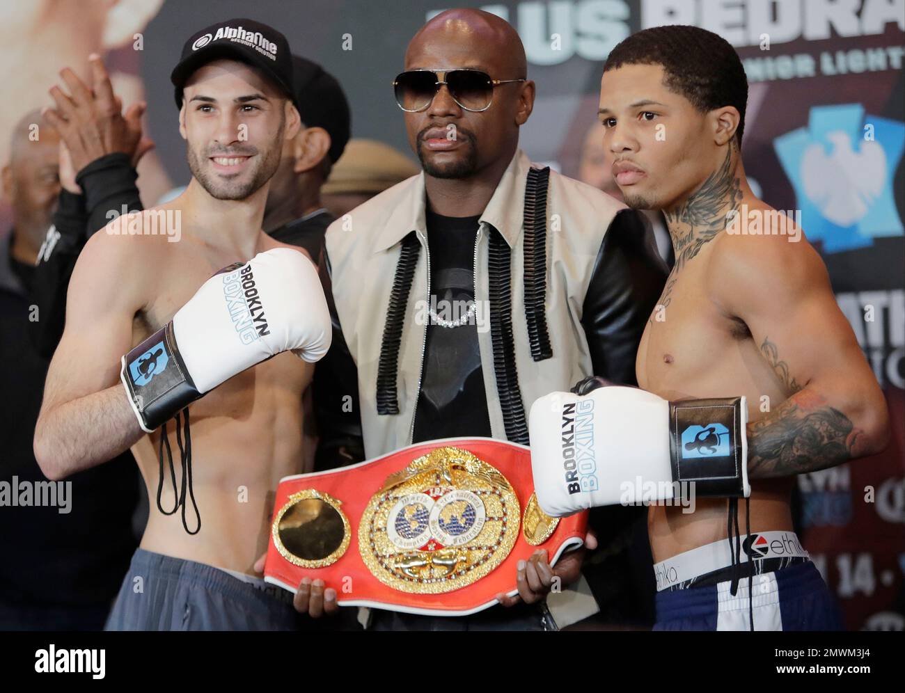 Jose Pedraza, of Puerto Rico, right, poses for photographs with ...