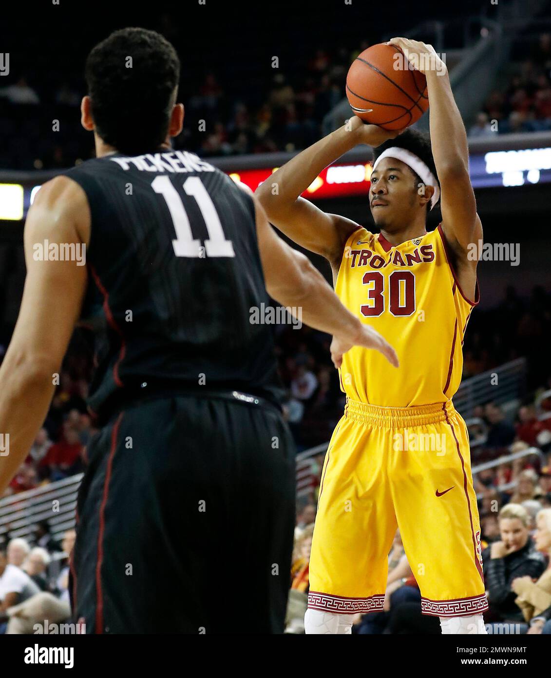 Southern California's Elijah Stewart, right, shoots next to Stanford's ...