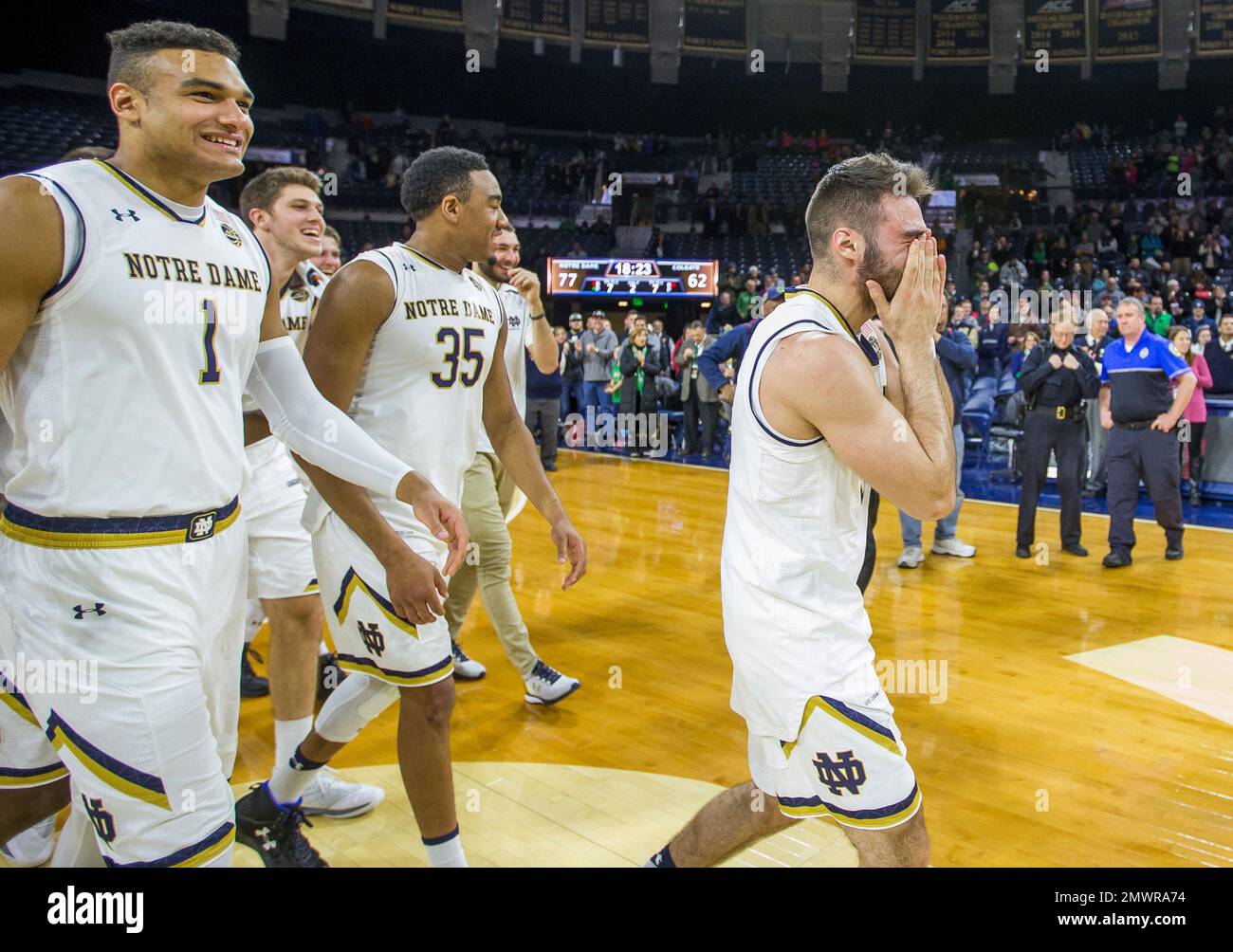 Notre Dame men's basketball player Matt Farrell, right, is surprised by ...