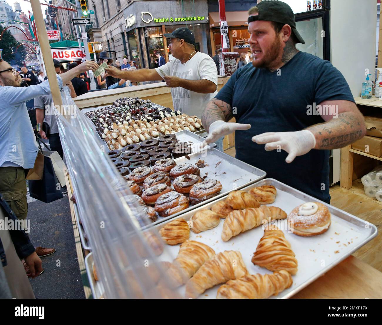 In this Thursday, Sept. 15, 2016 photo, pastry vendors Robert Diaz ...