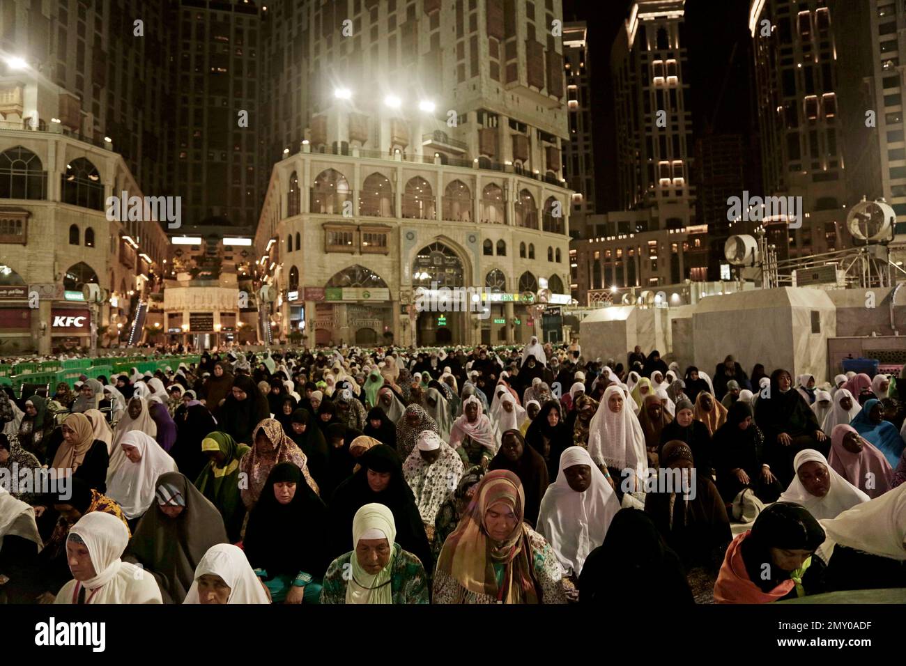 Muslim pilgrims pray the Fajr prayer before sunrise, outside the Grand ...