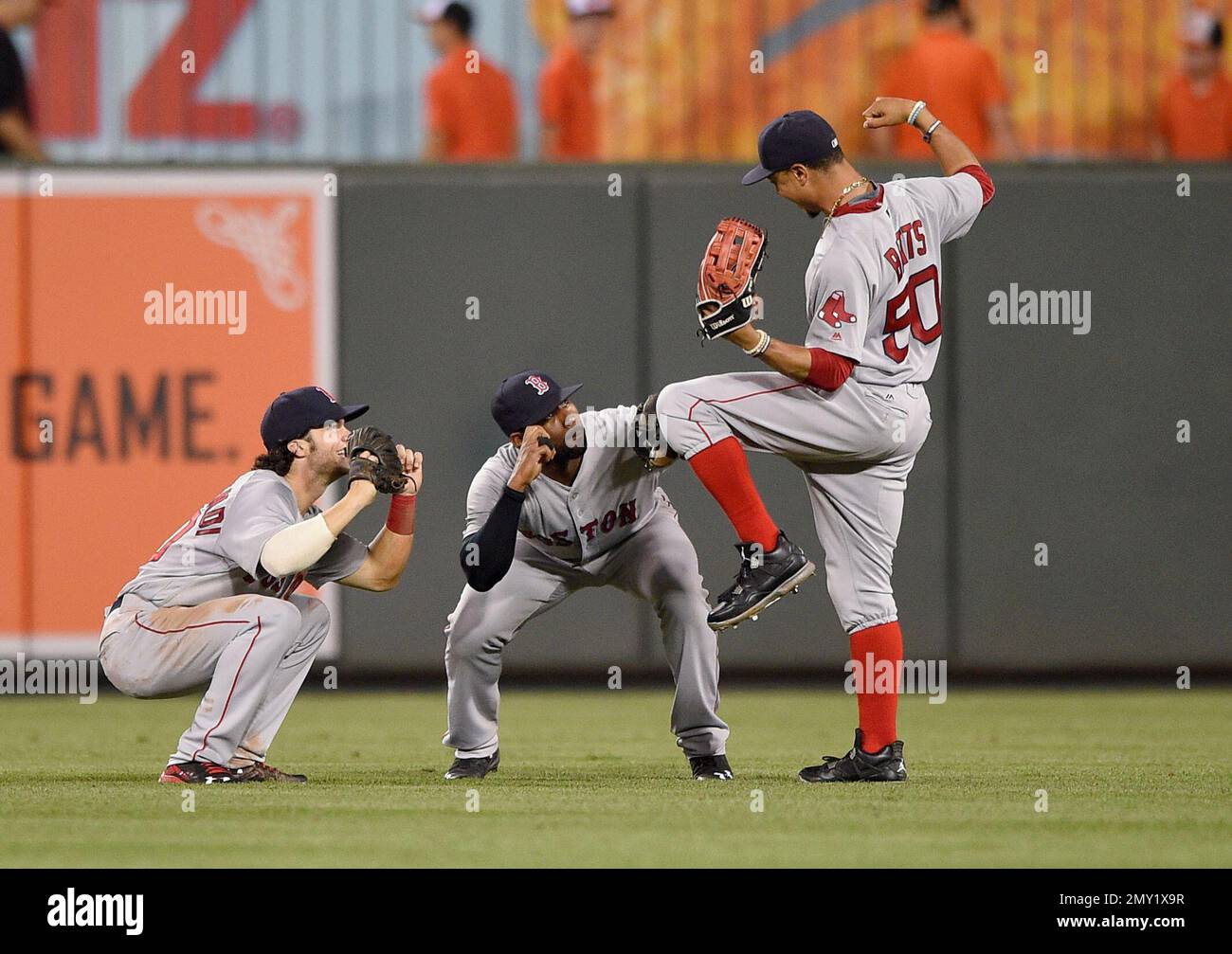 Boston Red Sox outfielders from right to left, Mookie Betts, Jackie ...