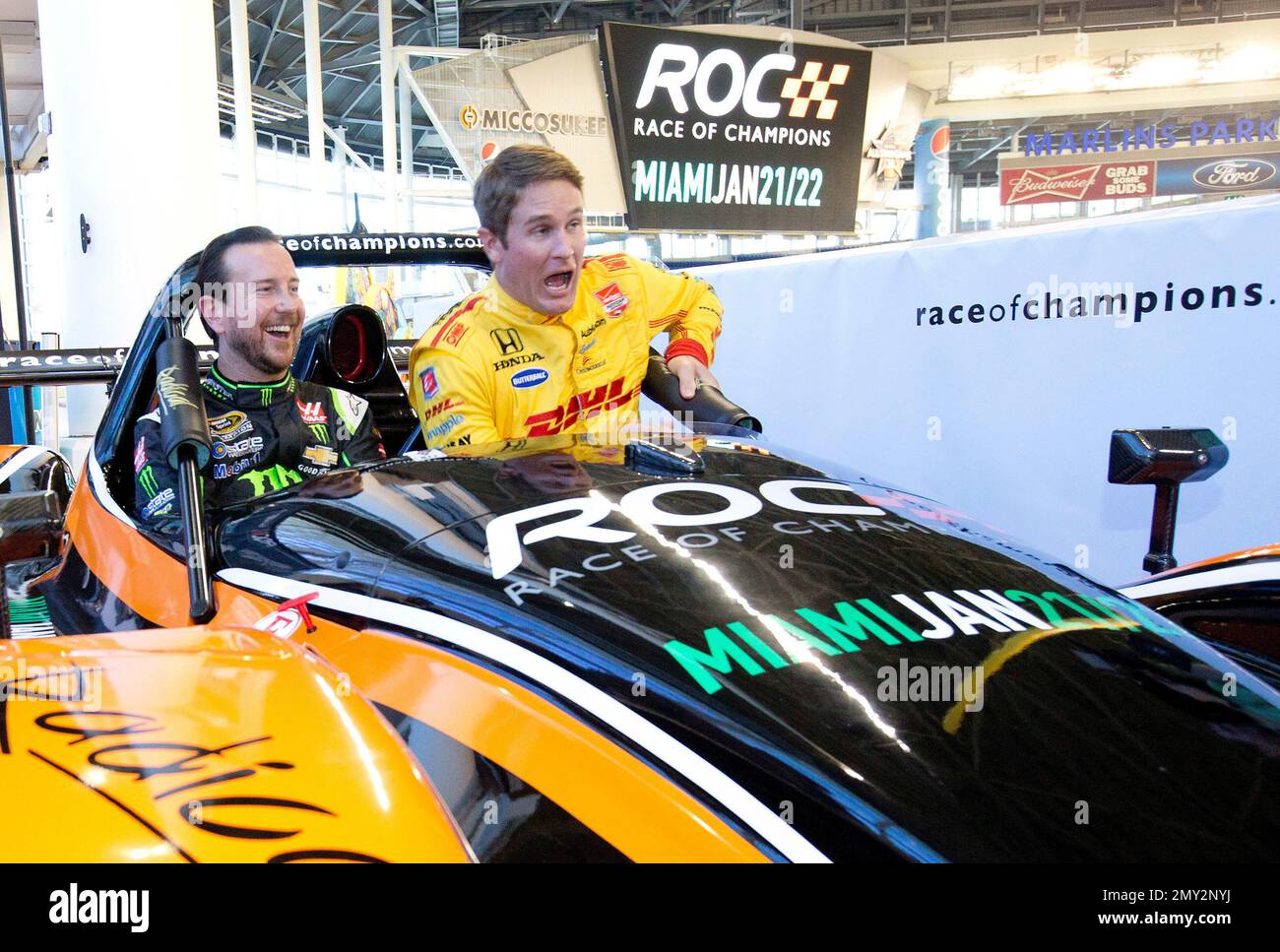 NASCAR Sprint Cup series driver Kurt Busch, left, and IndyCar series ...