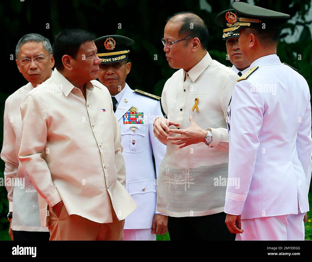 New Philippine President Rodrigo Duterte, second from left, talks with ...