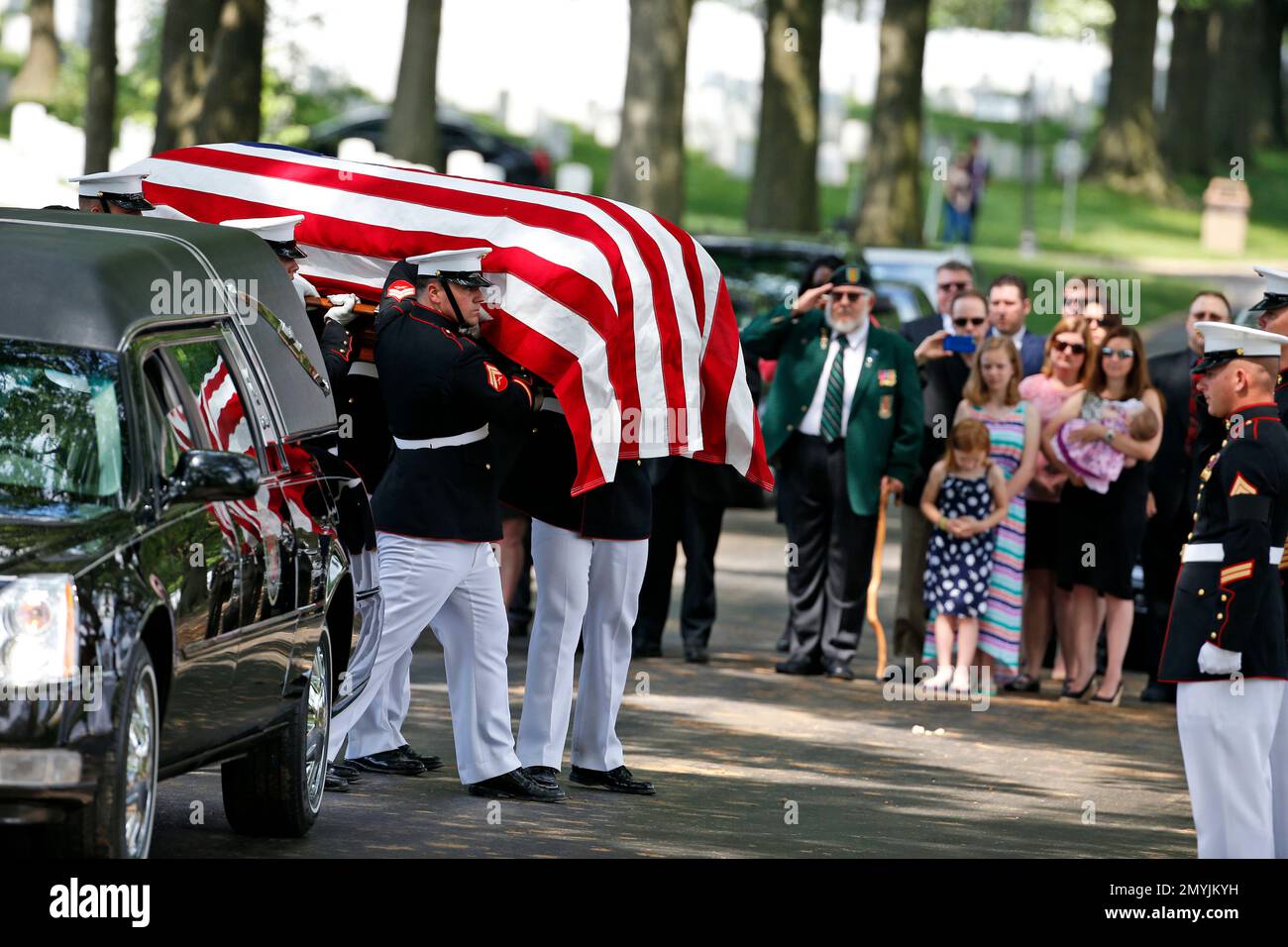 A U.S. Marine Corps casket team carries the remains of WWII Marine ...