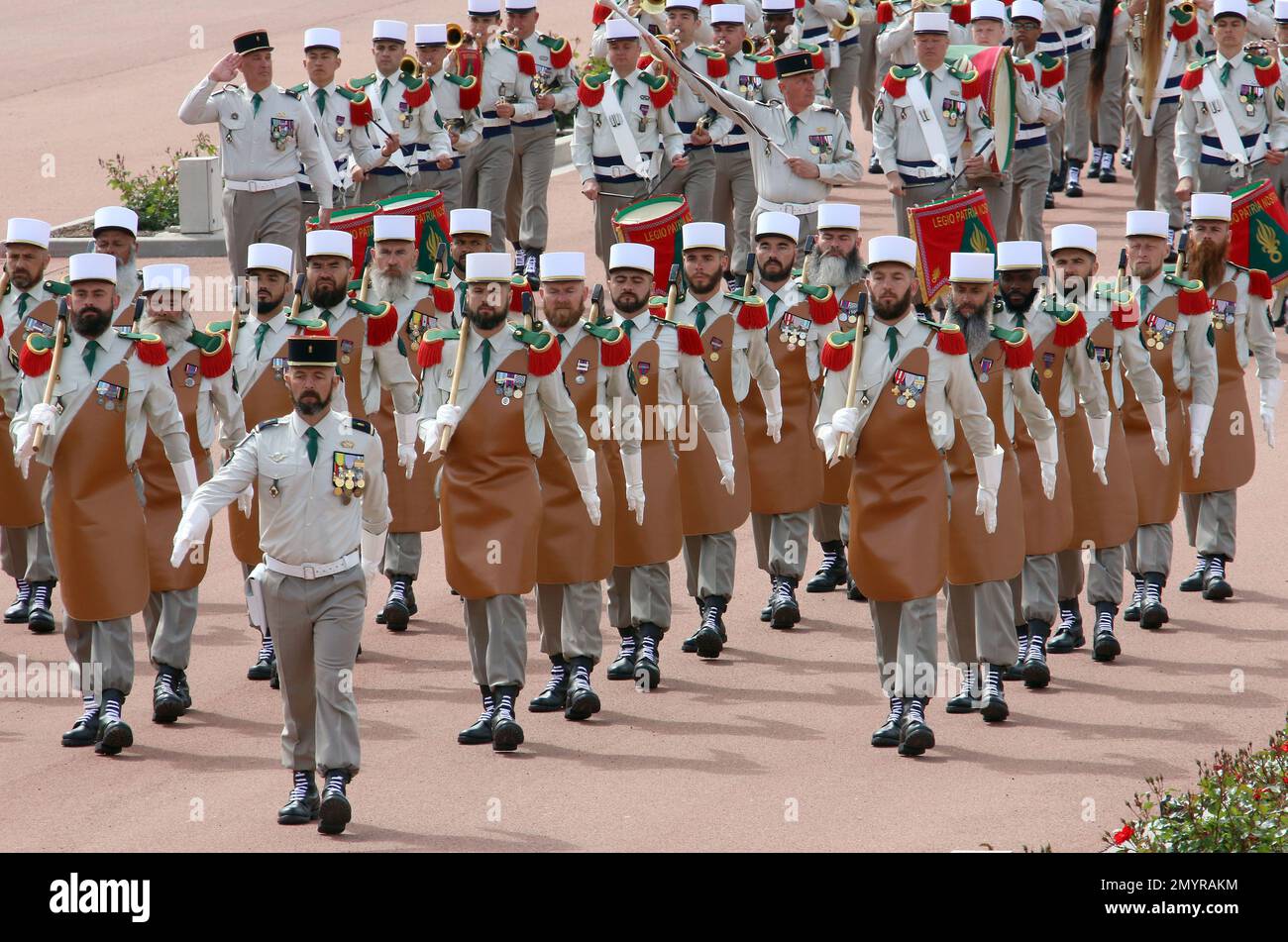 Legionnaires dressed in traditional pioneer outfits and holding hatchet ...
