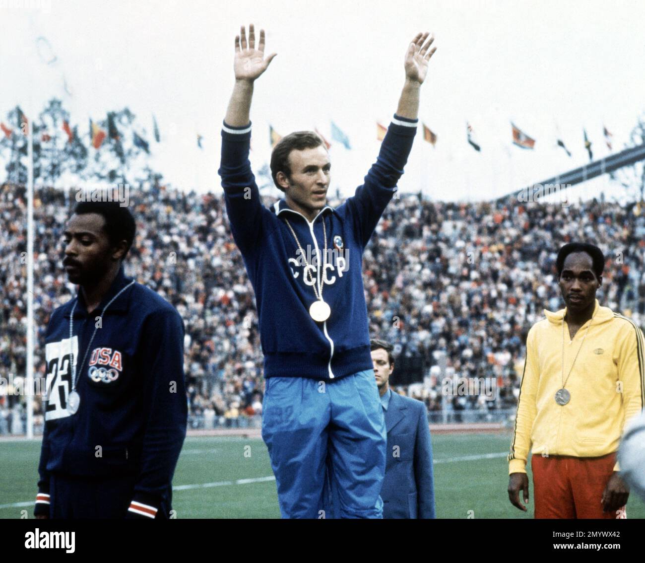 Valeriy Borzov of the Soviet Union stretches his arms in the air after ...