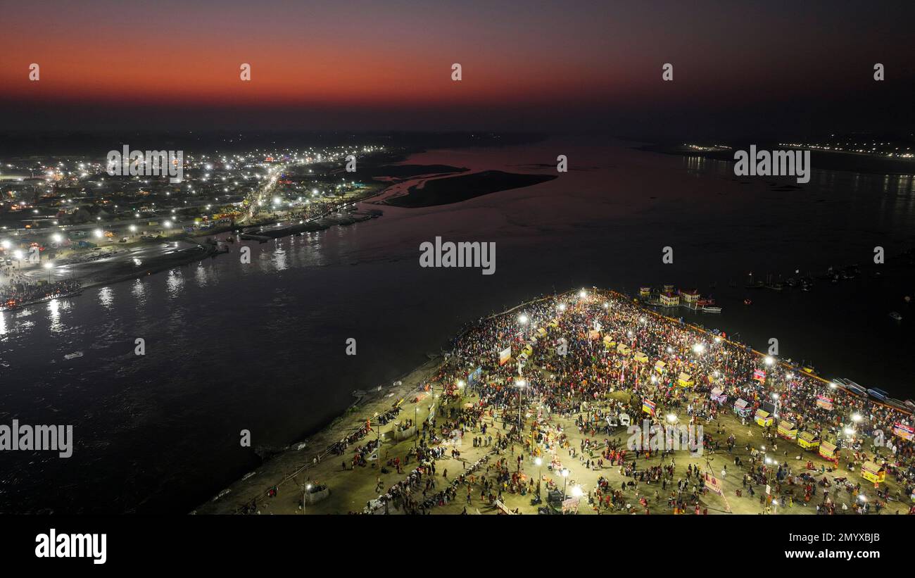 Hindu pilgrims gather at Sangam, the confluence of rivers the Ganges ...