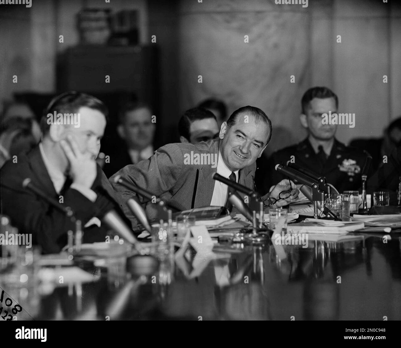 Sen. Joseph McCarthy (R-Wisc.), grins as Sen. John McClellan (D-Ark ...
