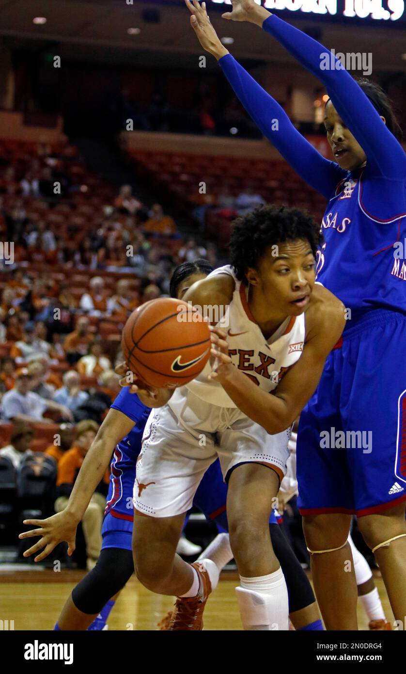 Texas center Imani Boyette, left, looks to pass against Kansas forward ...
