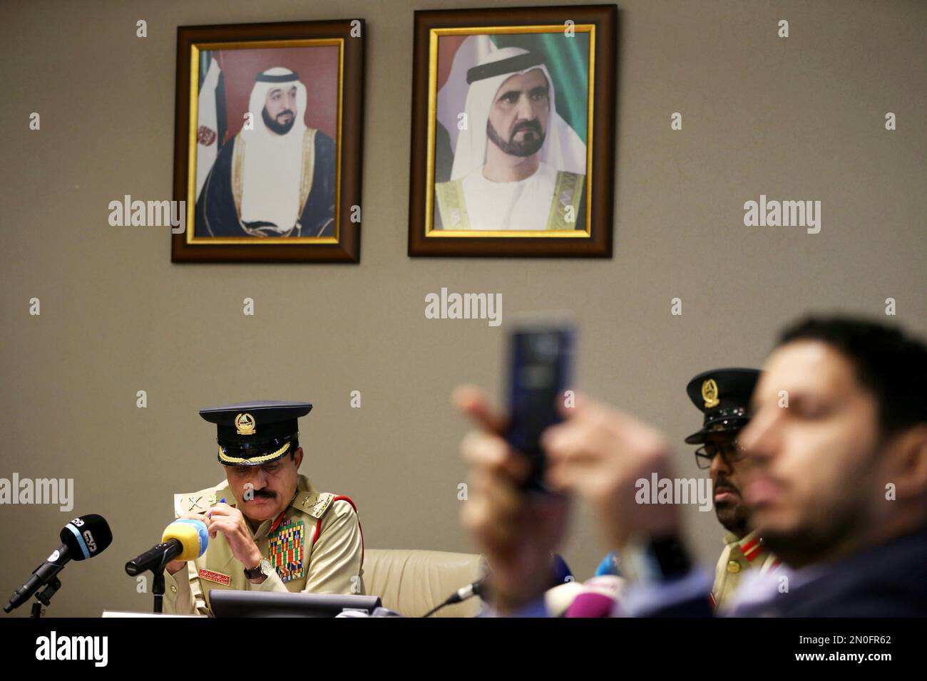 Dubai's police chief, Maj. Gen. Khamis Mattar al-Mazeina, listens to a ...