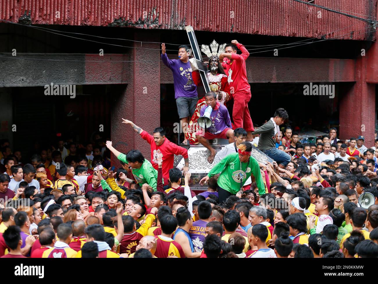 Filipino Catholic devotees jostle to get closer to the image of the ...