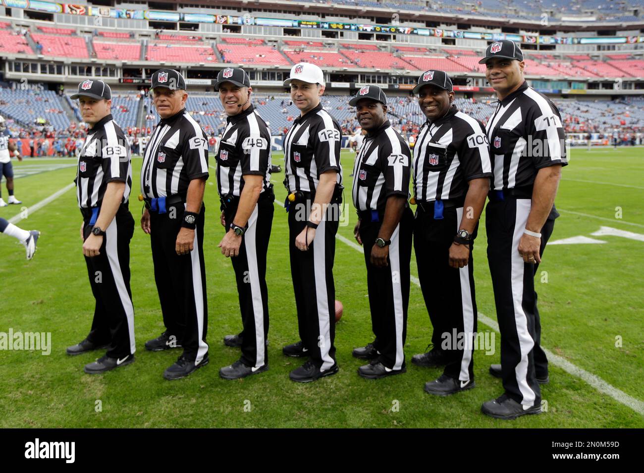 Officials pose before an NFL football game between the Tennessee Titans ...
