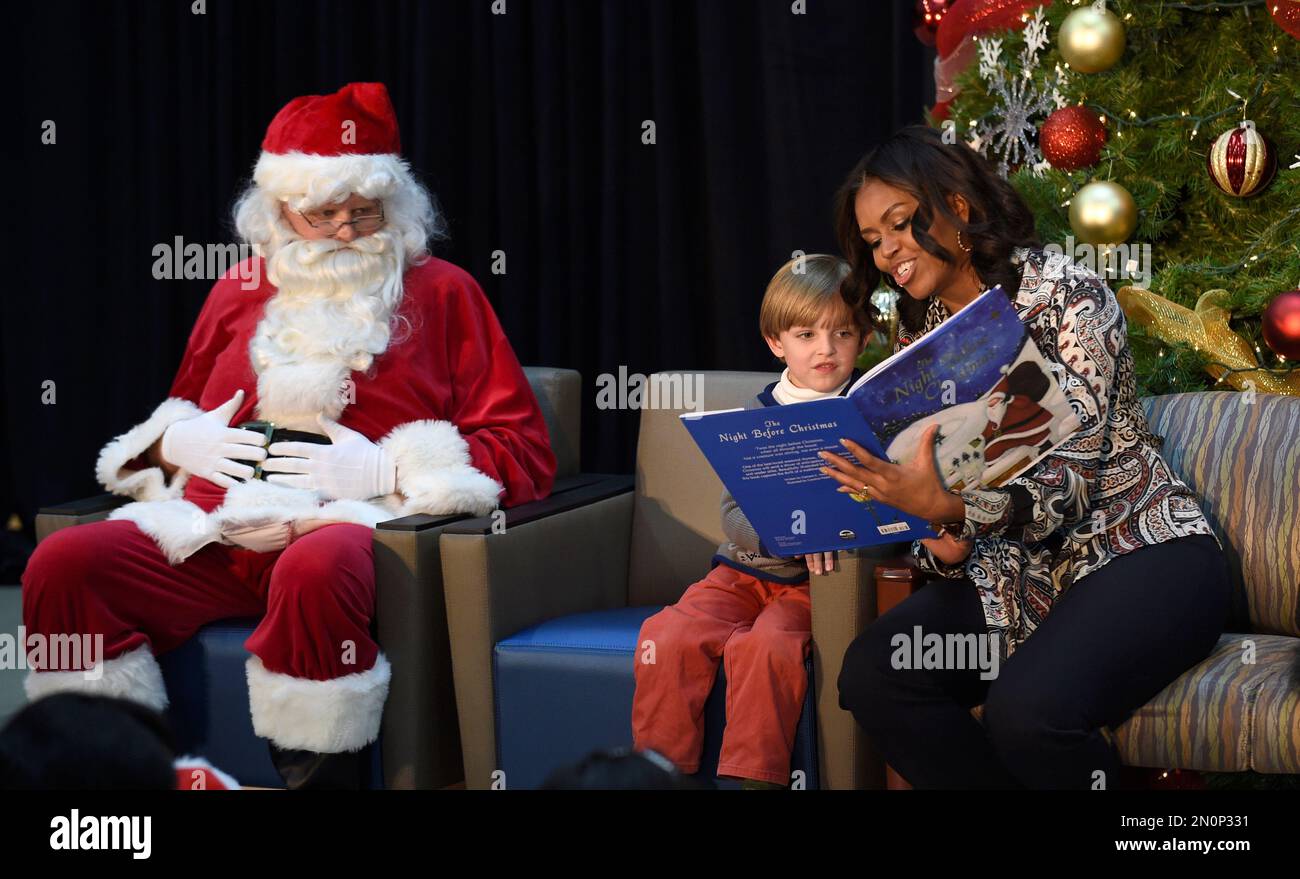 First lady Michelle Obama sits with Stephen Orzechowski, 5, center, and ...
