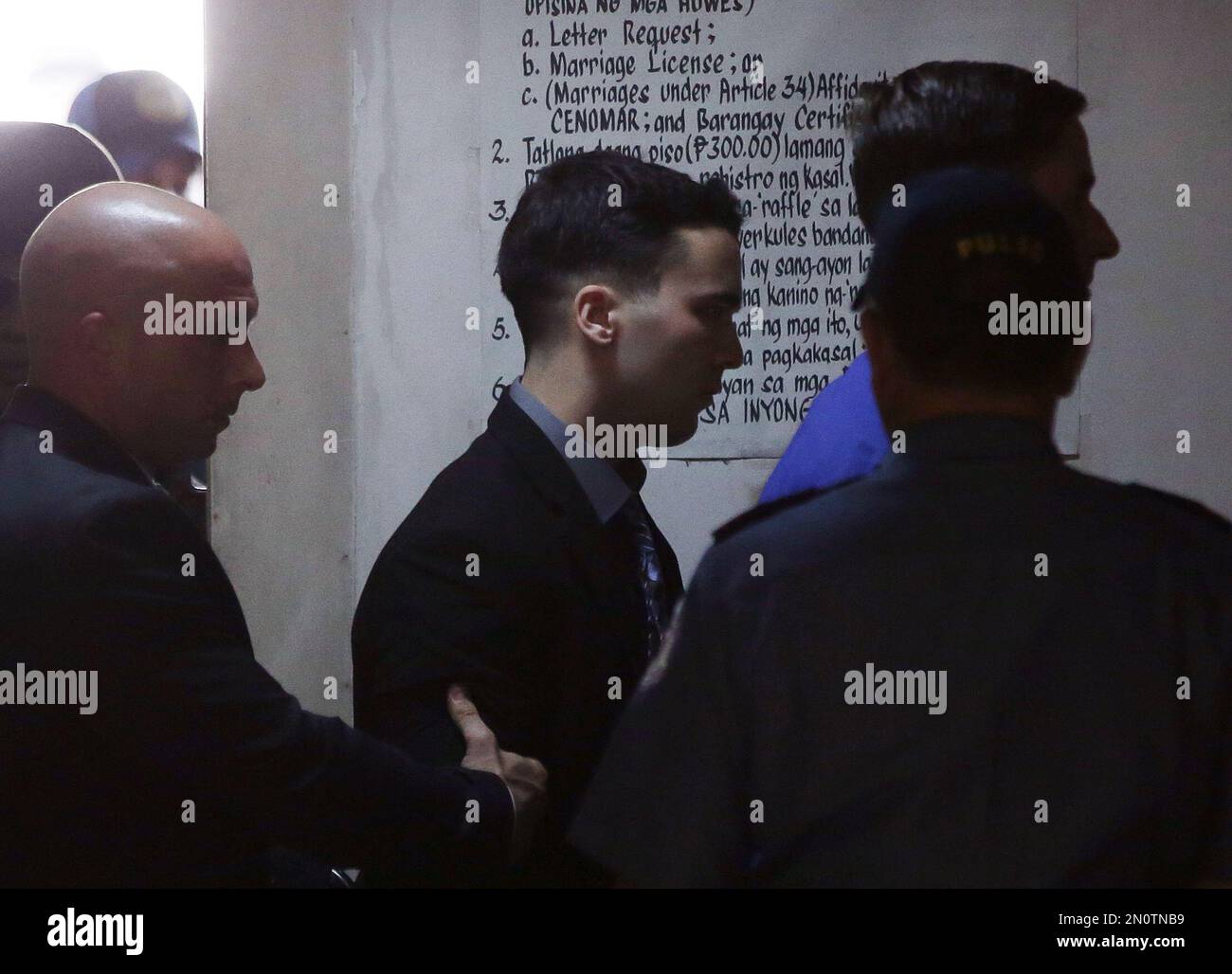 U.S. Marine Lance Cpl. Joseph Scott Pemberton, center, accused of ...