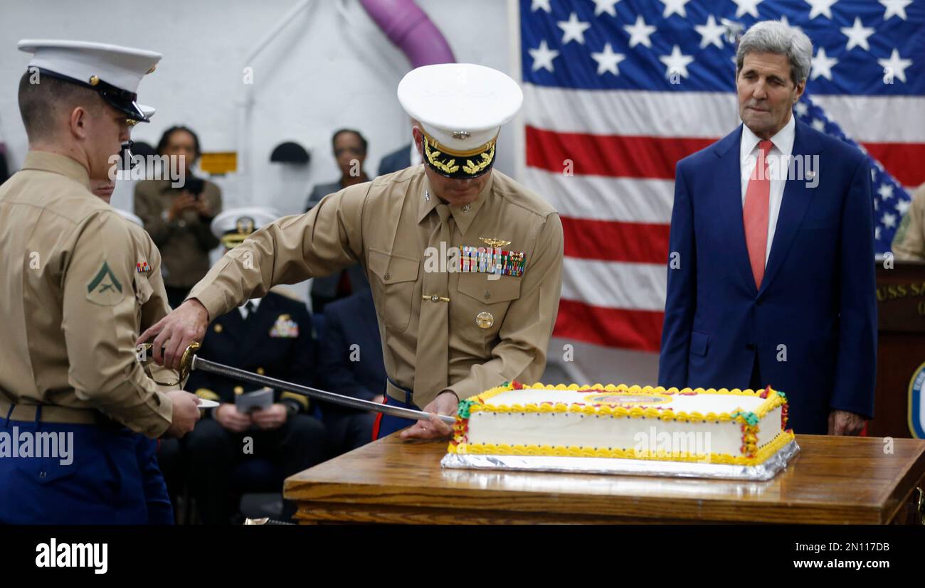 Secretary of State John Kerry watches as Commander US Marine Corps ...