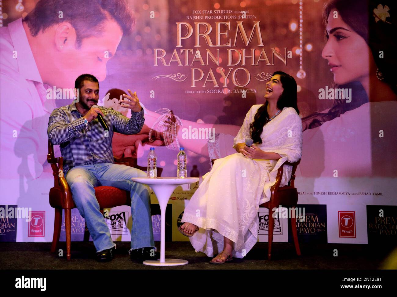 Bollywood actors Salman Khan, left and Sonam Kapoor share a lighter ...