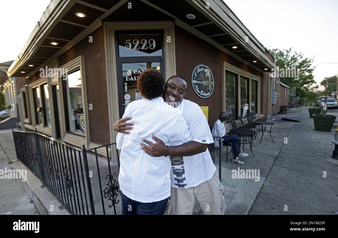 Corey Hinton, right, hugs his close friend Keisha Henry, owner of Cafe ...