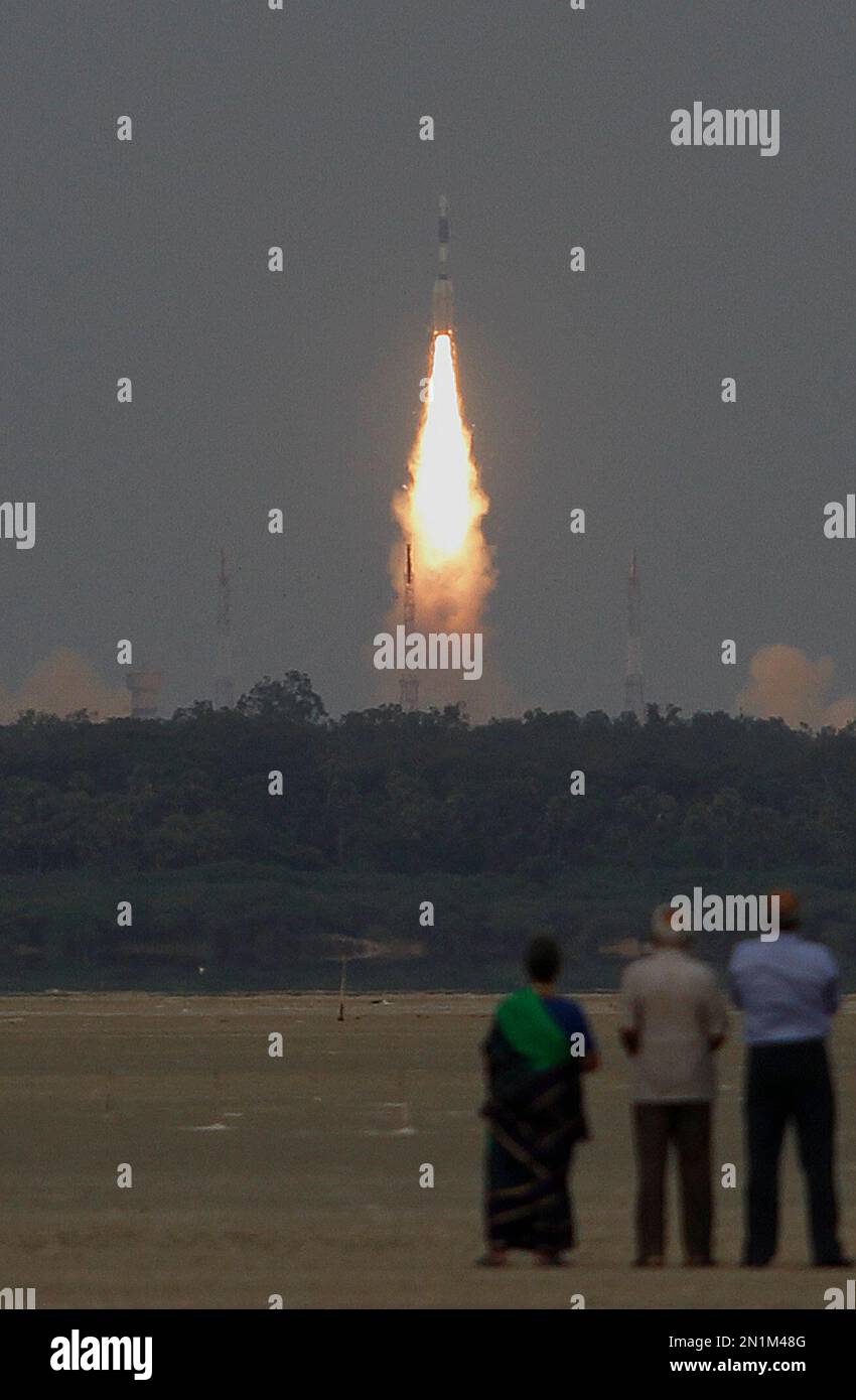 People watch as Indian Space Research Organization (ISRO)’s ...