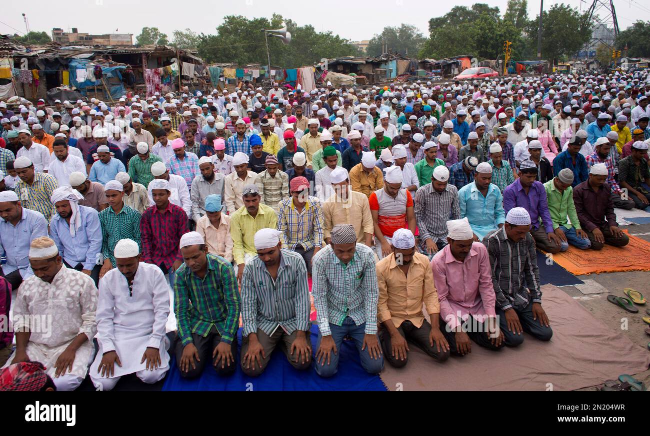 Indian Muslim men offer the last Friday prayers of the Islamic holy ...