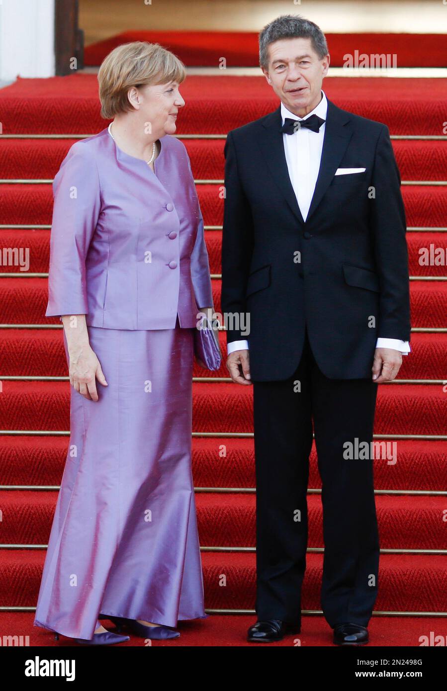 German Chancellor Angela Markel, left, and her husband Joachim Sauer ...