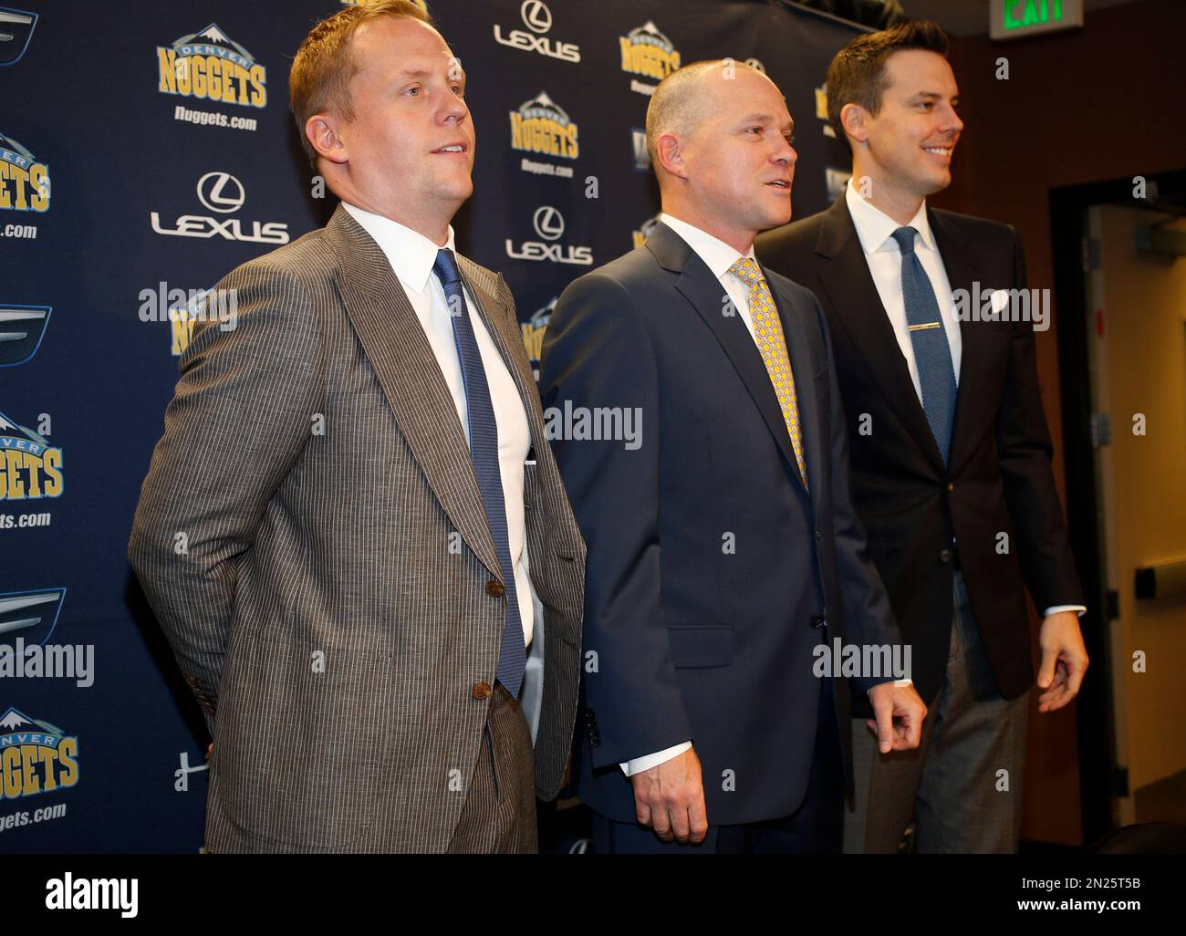 Denver Nuggets new coach Michael Malone, center, is flanked by Josh ...