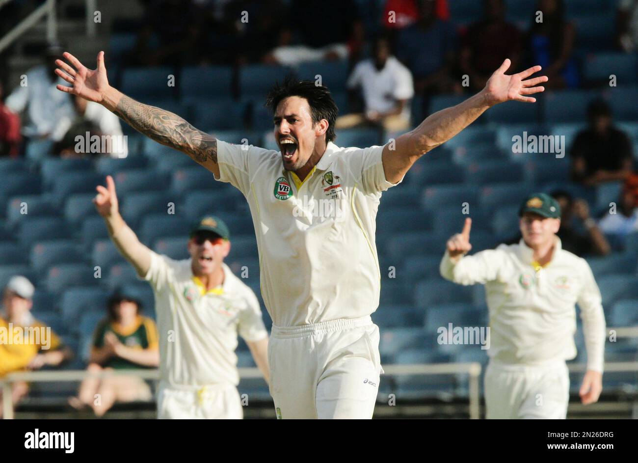Australia's bowler Mitchell Johnson, center, appeal successfully for ...