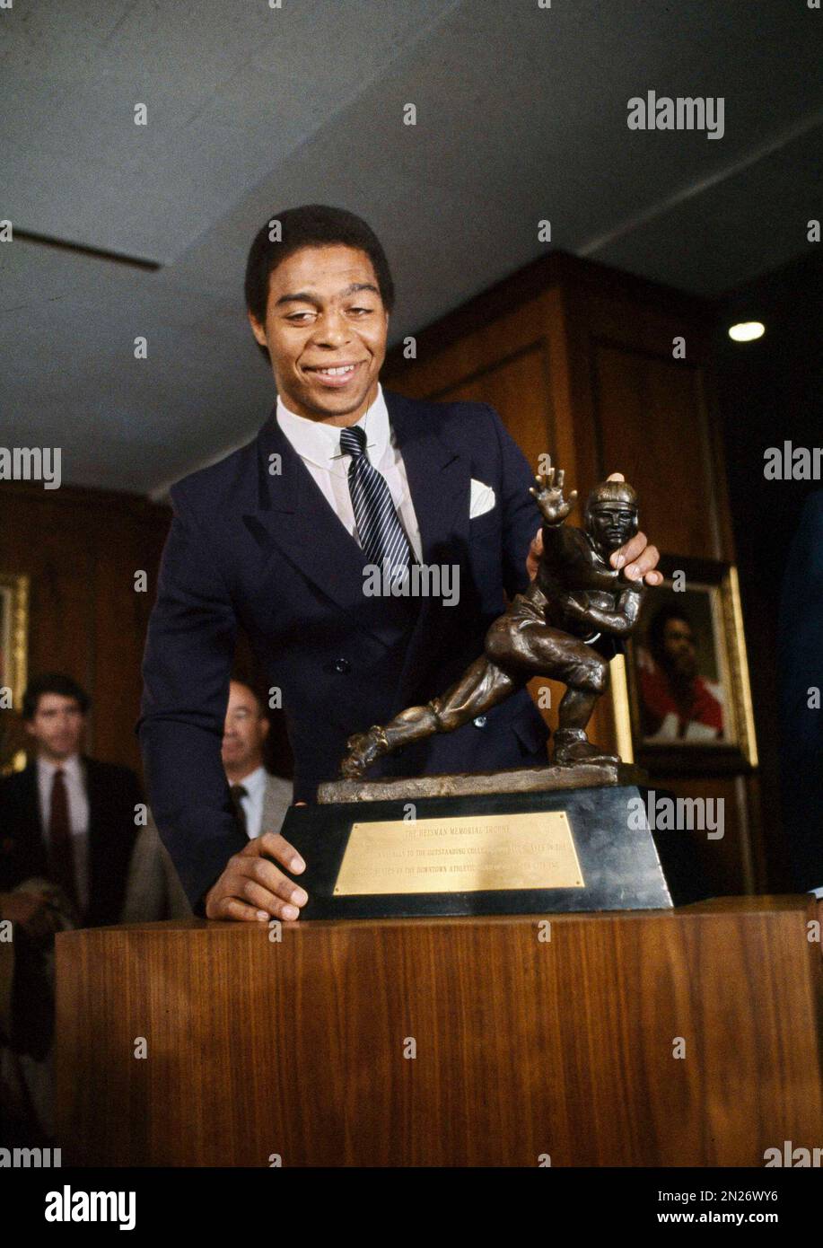 Marcus Allen of the USC Trojans, poses with the coveted Heisman Trophy ...