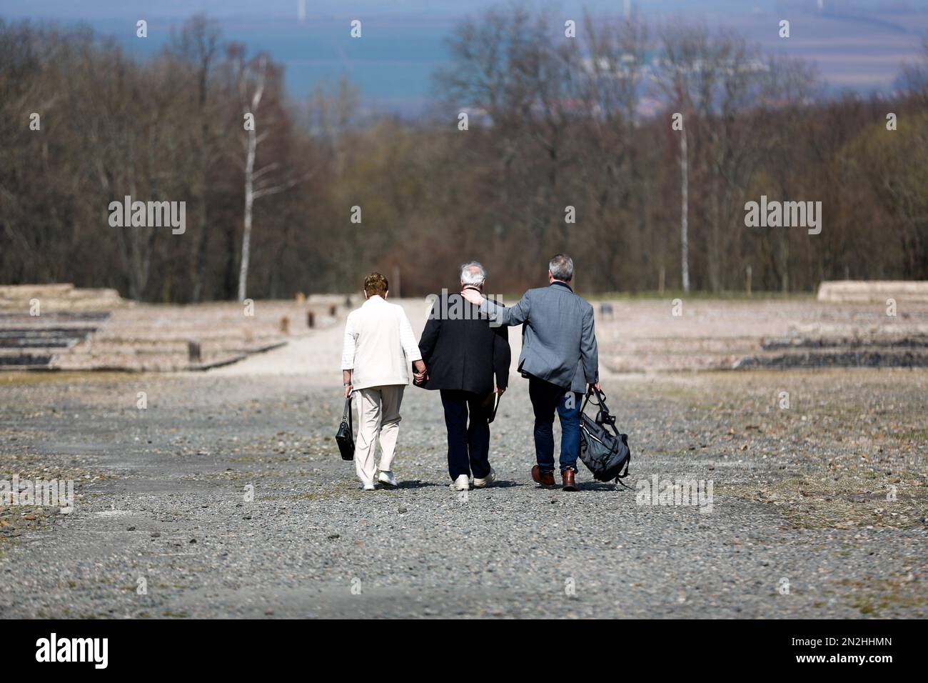In this Friday, April 10, 2015 photo Henry Oster, center, survivor of ...