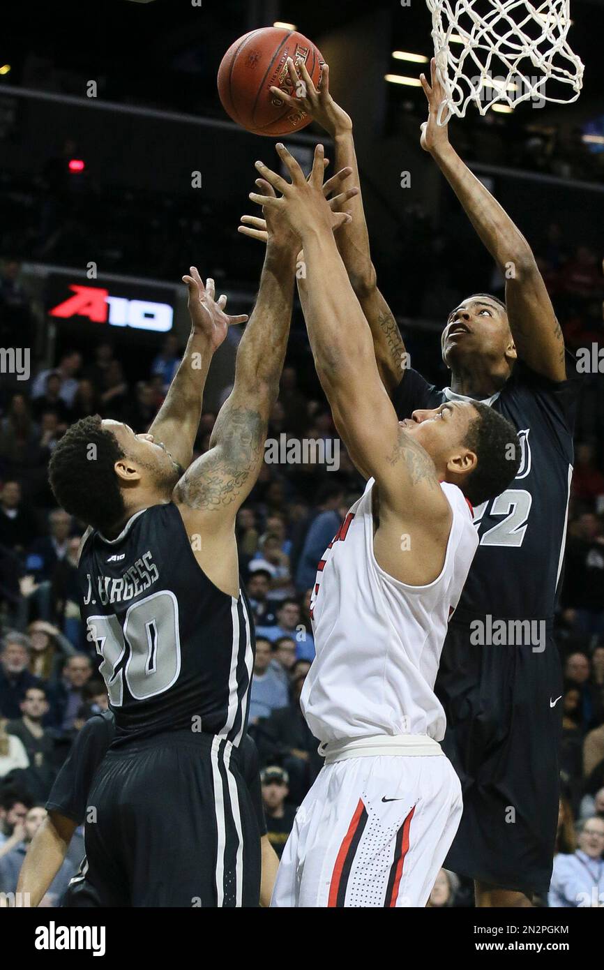 VCU guard Jordan Burgess (20), guard/forward Terry Larrier (22), and ...