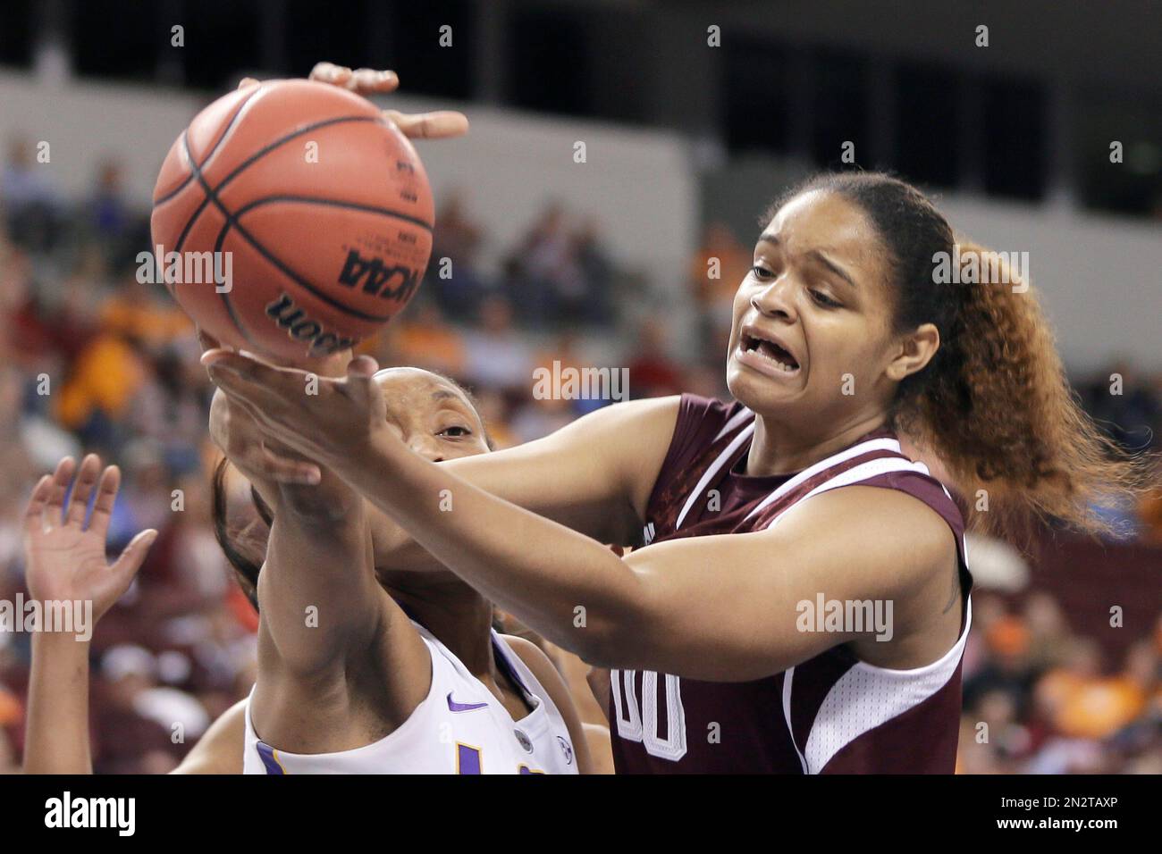 Texas A&M's Khaalia Hillsman (00) reaches for a rebound in front of LSU ...