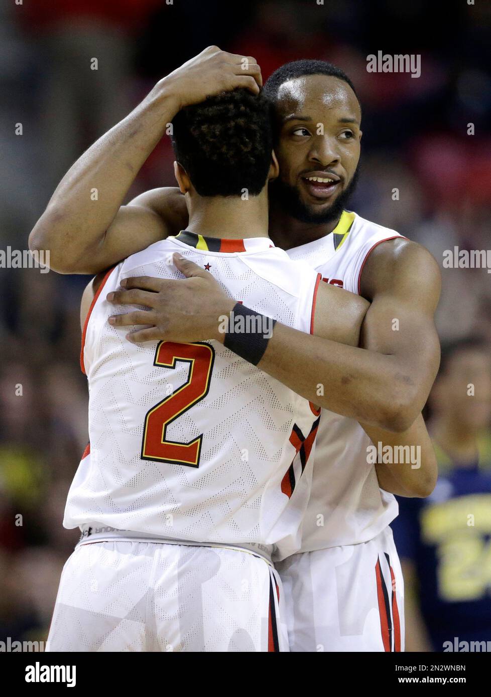 Maryland guard/forward Dez Wells, right, hugs teammate Melo Trimble in ...