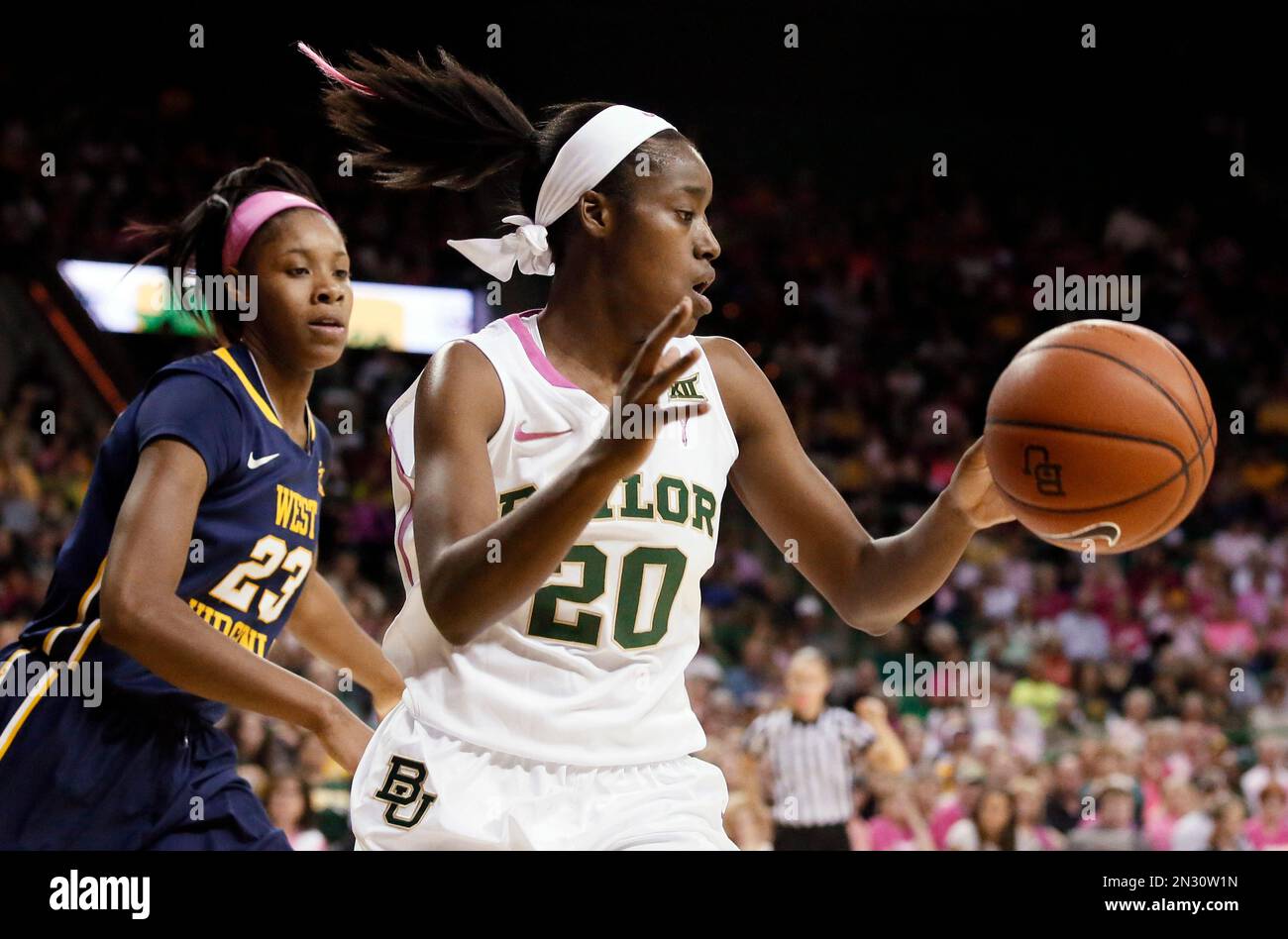 Baylor guard Imani Wright (20) takes an inbound pass in front of West Virginia's Bria Holmes (23 ...