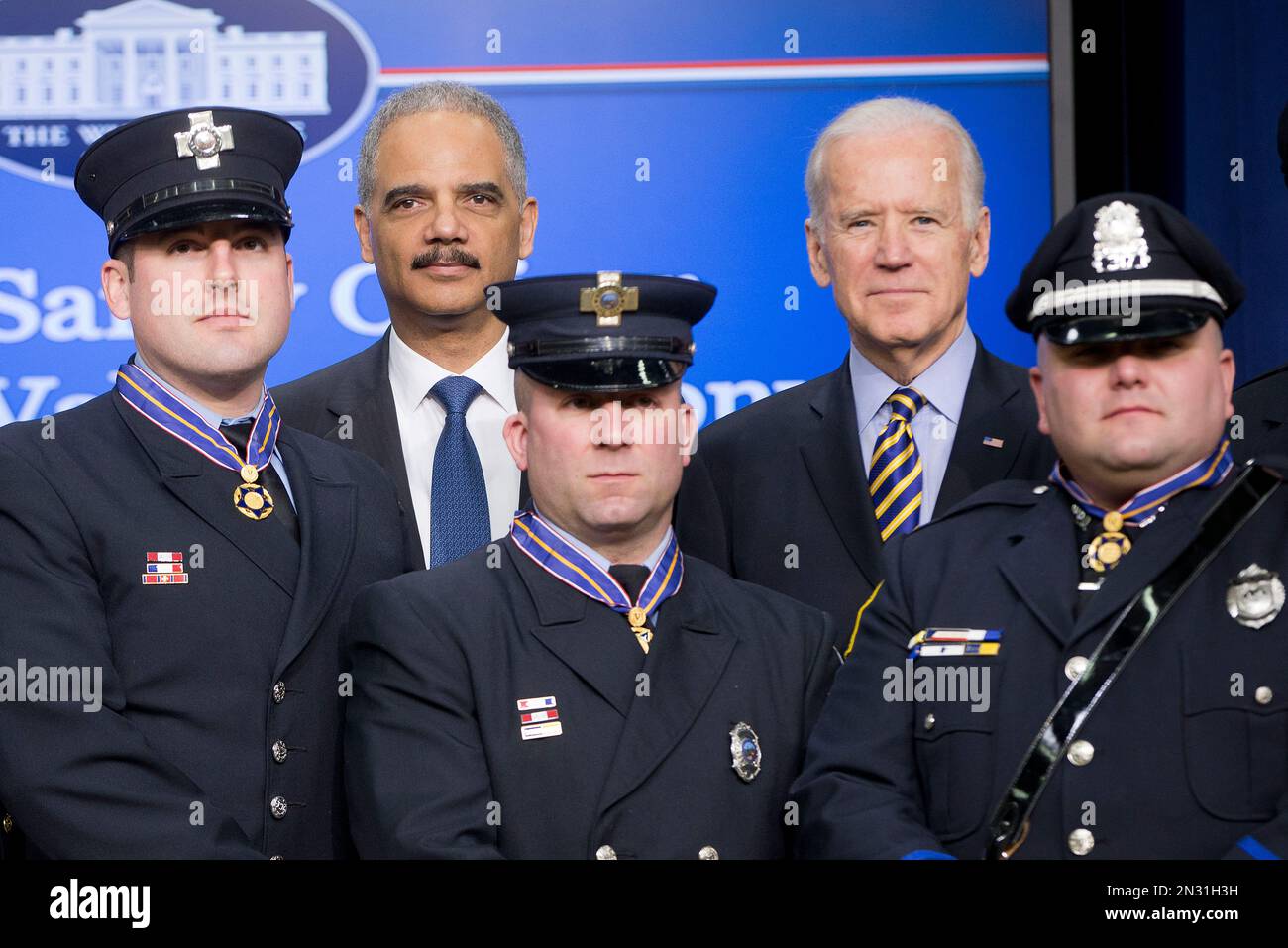 Attorney General Eric Holder and Vice President Joe Biden pose with the ...