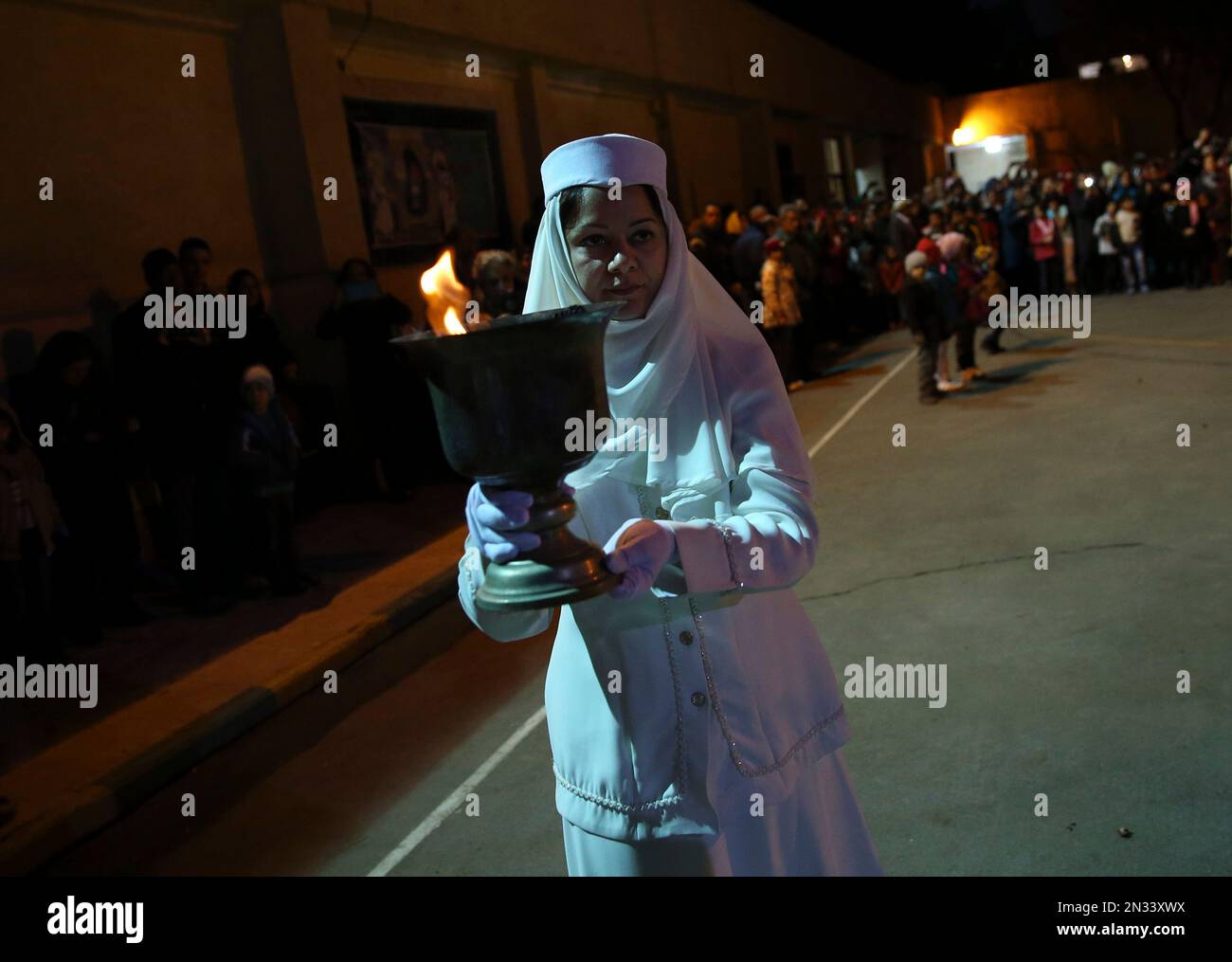 Iranian Zoroastrian female priest Rashin Jahangiri carries a torch to ...