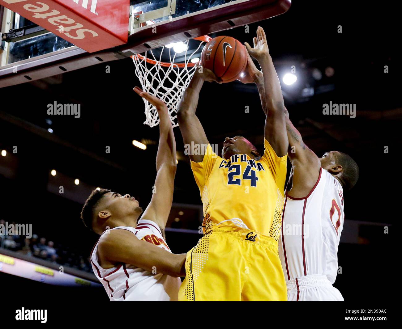Southern California forward Darion Clark, right, blocks a shot by ...