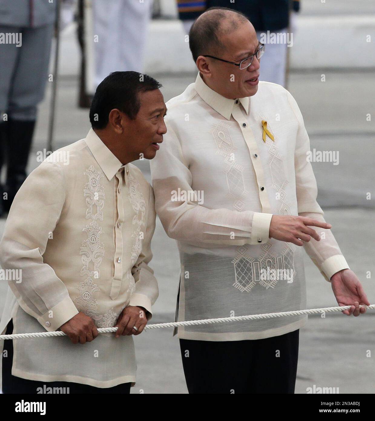 Philippine President Benigno Aquino III, right, talks to Vice-President ...