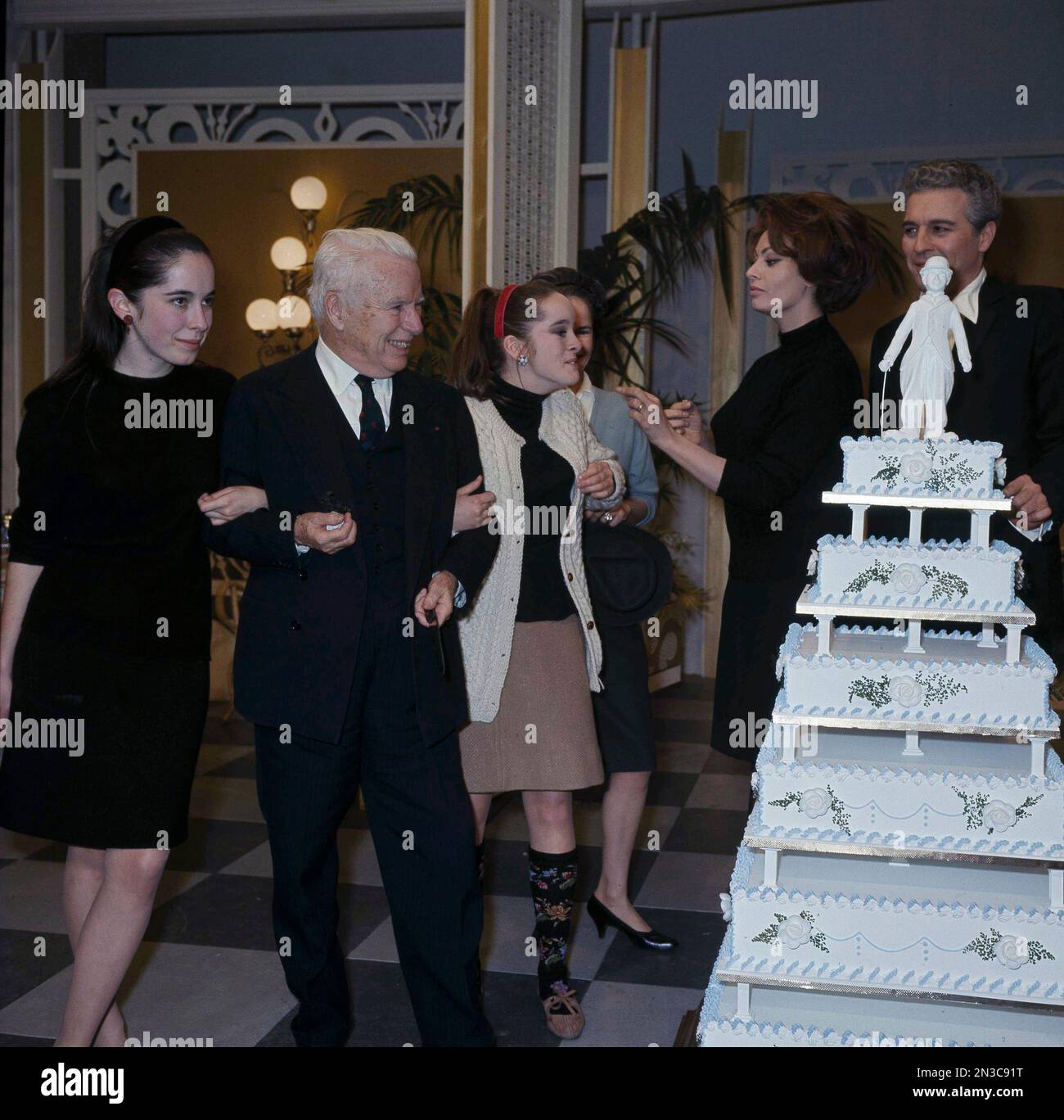 Flanked by two of his daughters, Josephine, left, and Victoria, right ...
