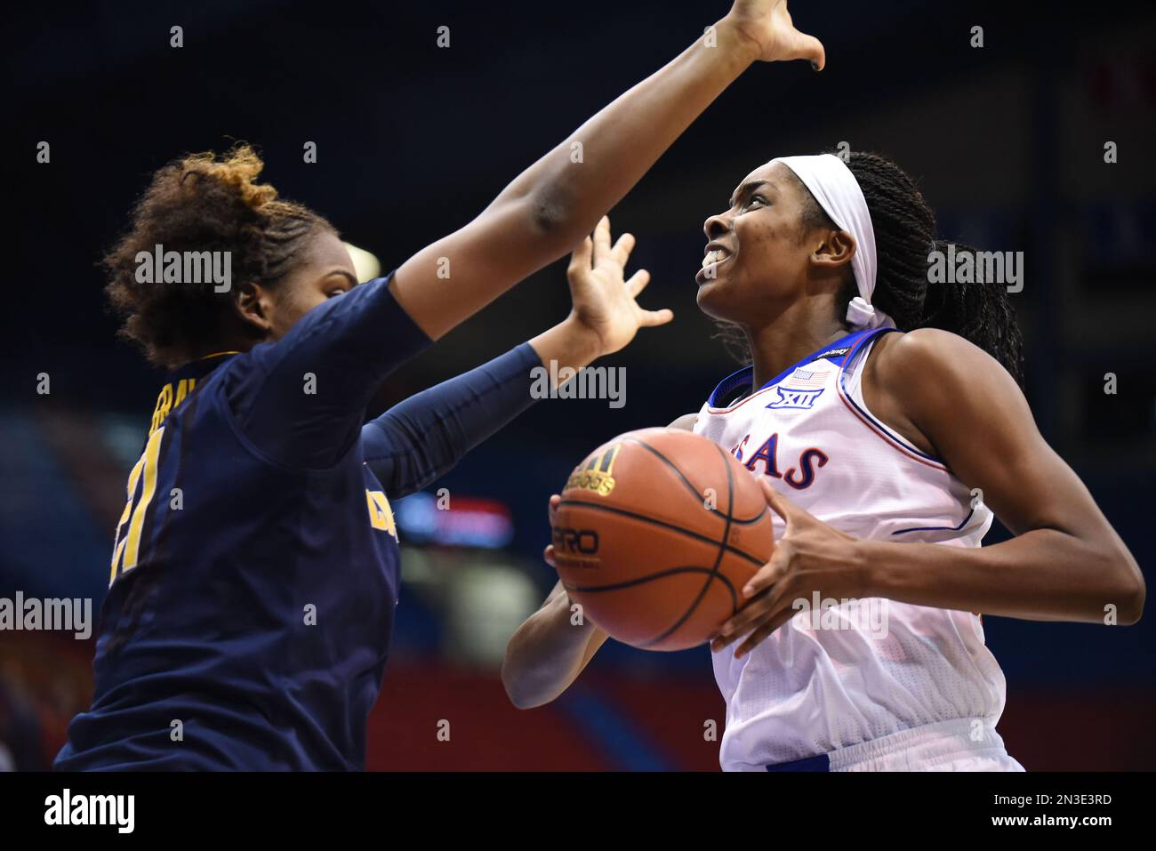 Kansas forward Chelsea Gardner, right, drives to the goal against ...