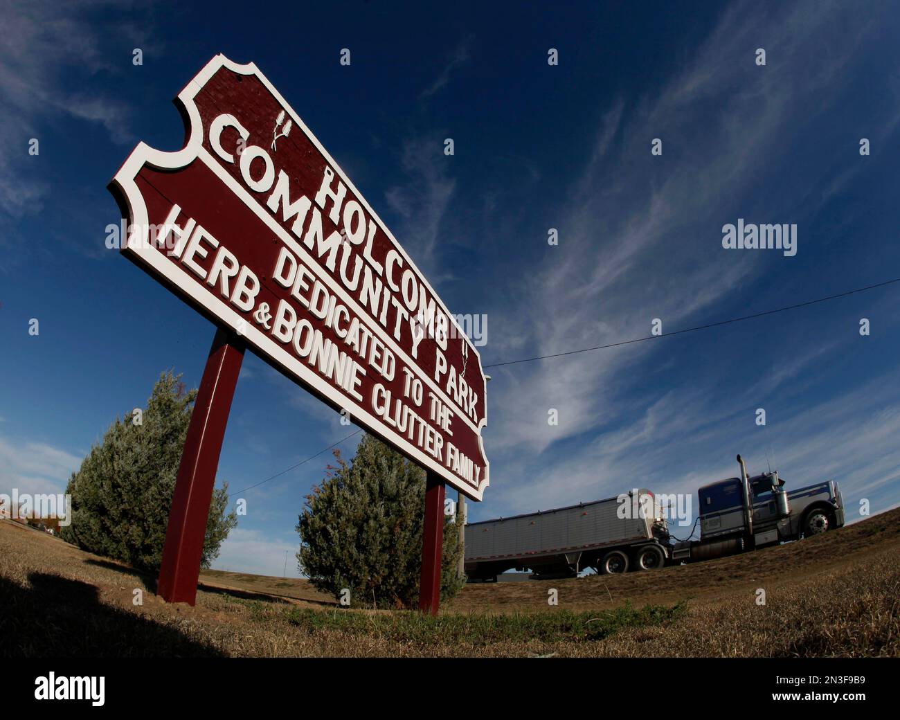 FILE- In this photo taken Oct. 19, 2009, a grain truck passes by a park ...