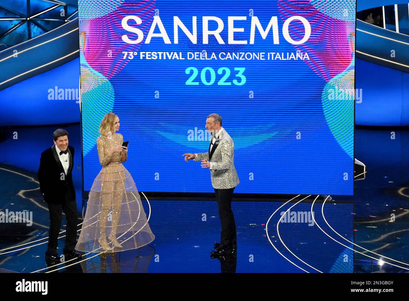 From left, Gianni Morandi, Chiara Ferragni and Amadeus attend the first ...