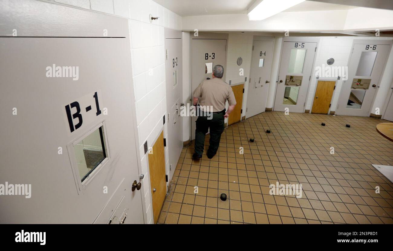 In this photo taken Oct. 15, 2014, Corrections Deputy Kent Wales looks ...