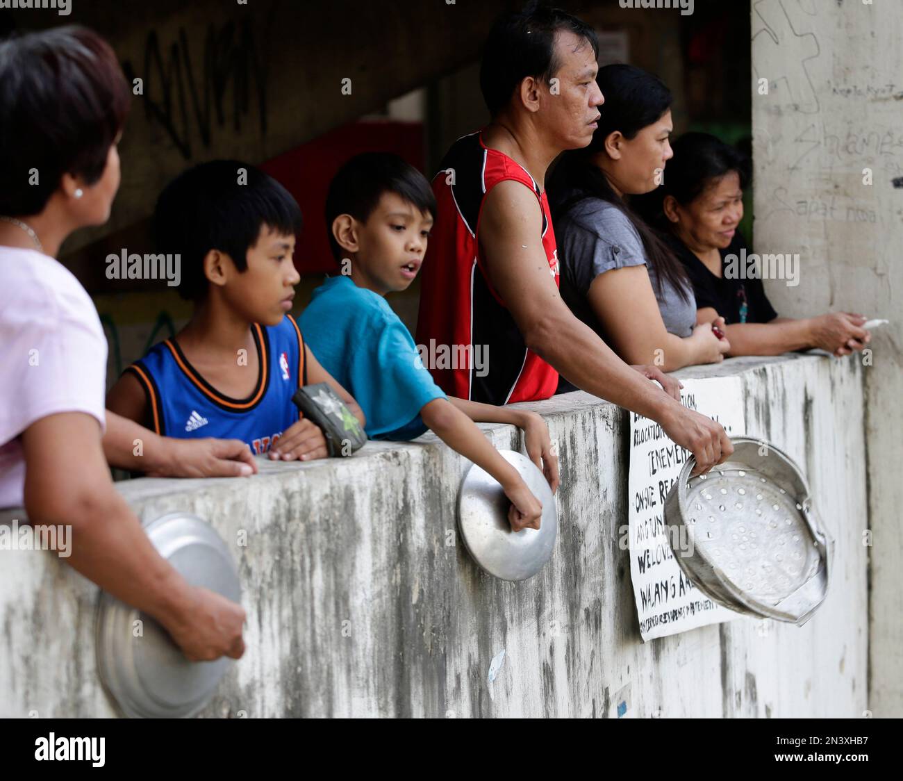 Residents bang pots and pans as they stage a "noise barrage" to protest ...